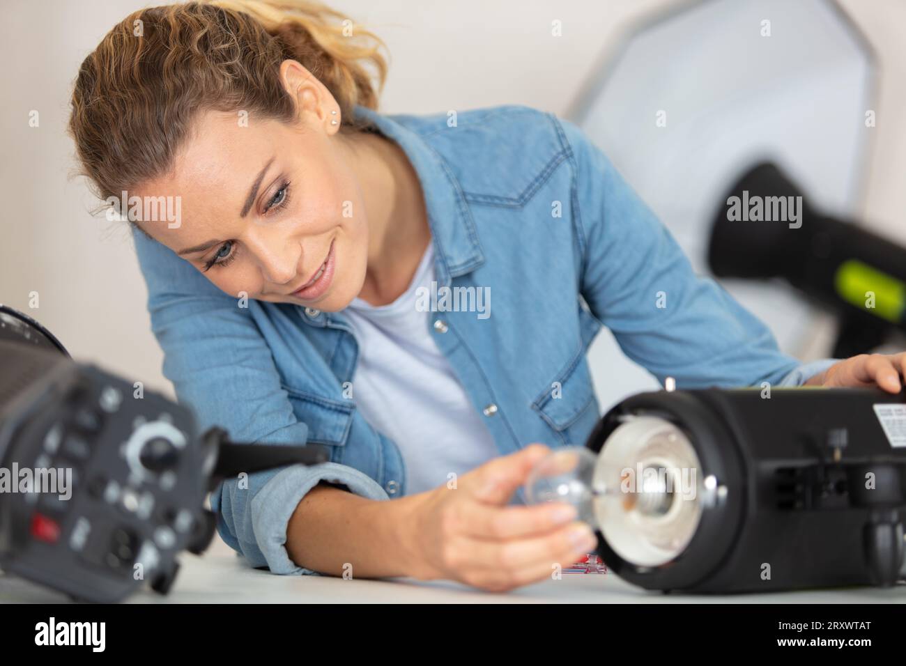 Young woman repairing photography hi-res stock photography and images ...