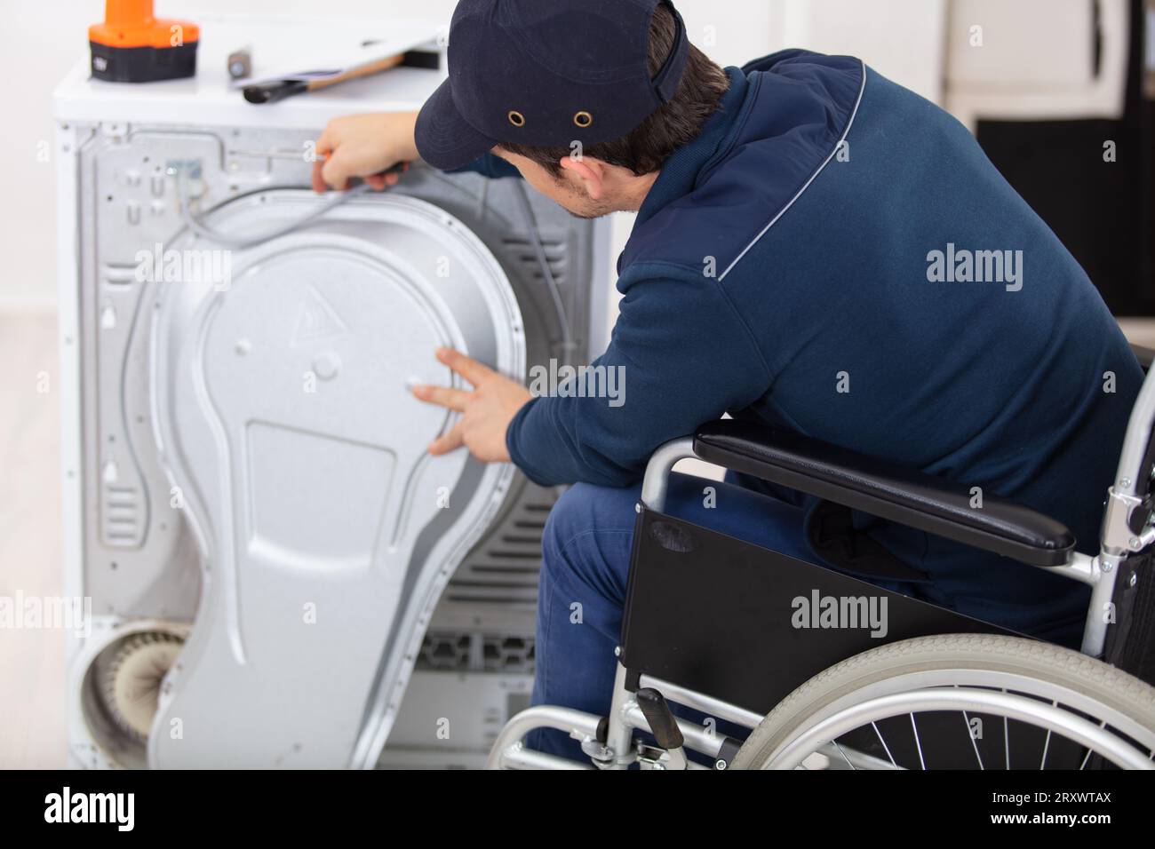 Repairing washing machine hi-res stock photography and images - Alamy
