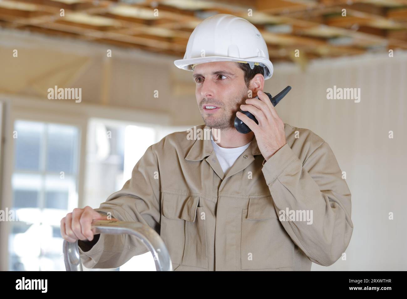 smart engineer with white safety helmet holding walkie-talkie Stock ...