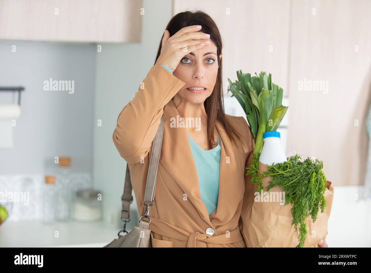 woman who forgot something during shopping Stock Photo - Alamy