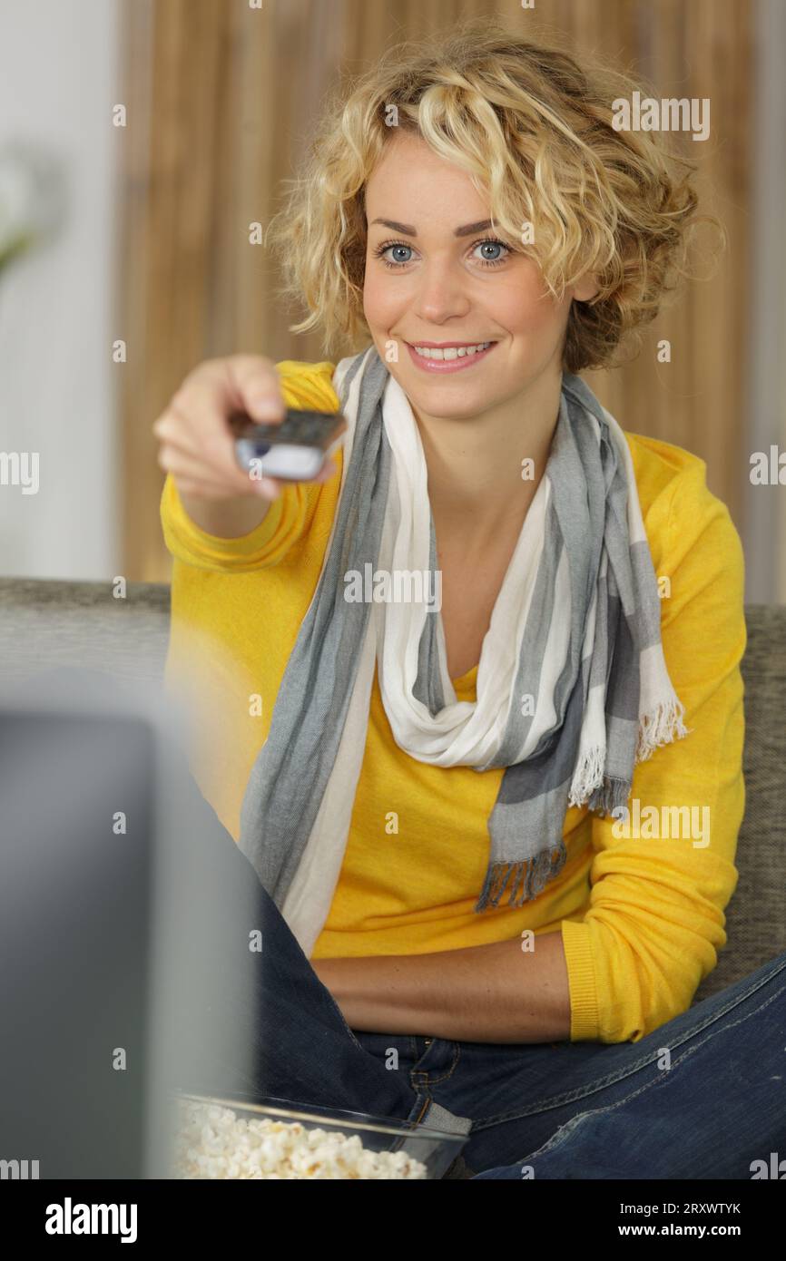Woman changing channel hi-res stock photography and images - Alamy