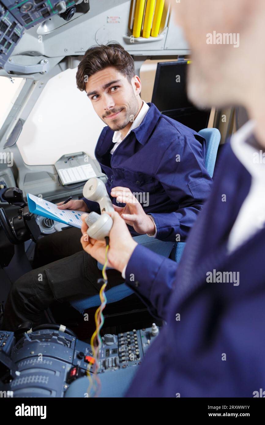 a captain piloting an airplane Stock Photo - Alamy