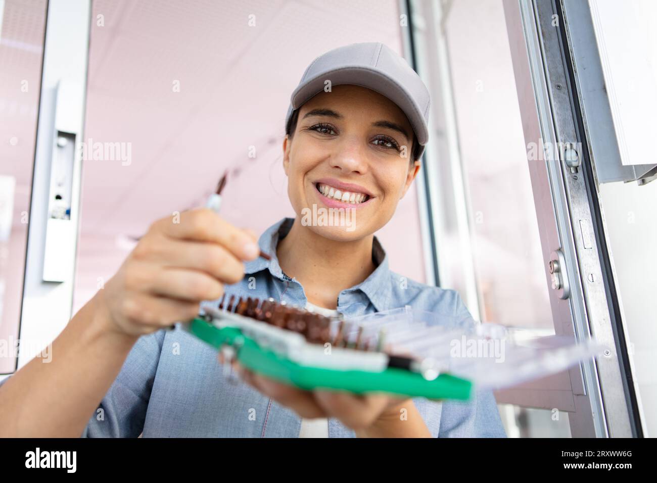 woman with kit of tools installing aluminium window Stock Photo - Alamy