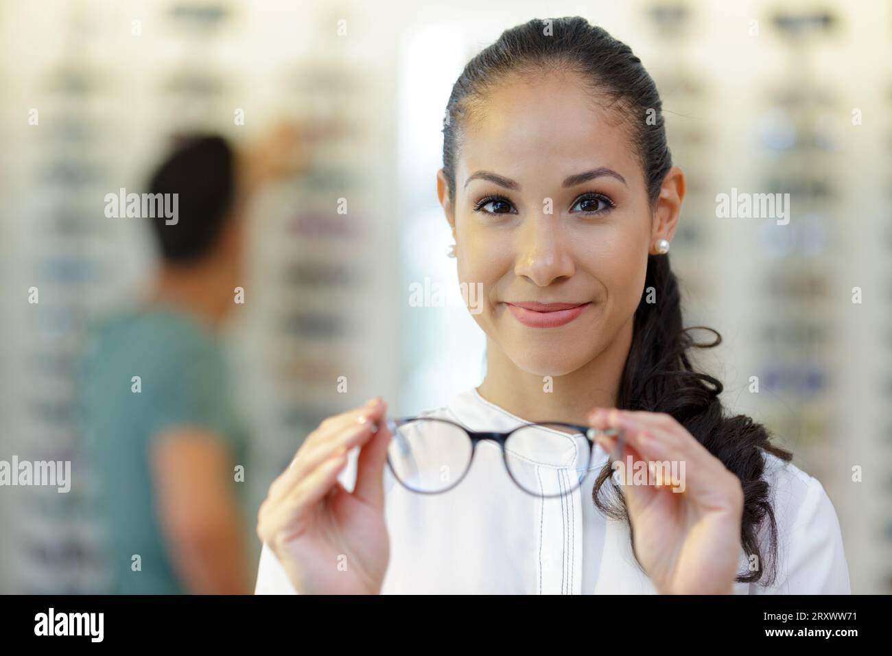 Woman tries choose eyeglasses hi-res stock photography and images - Alamy