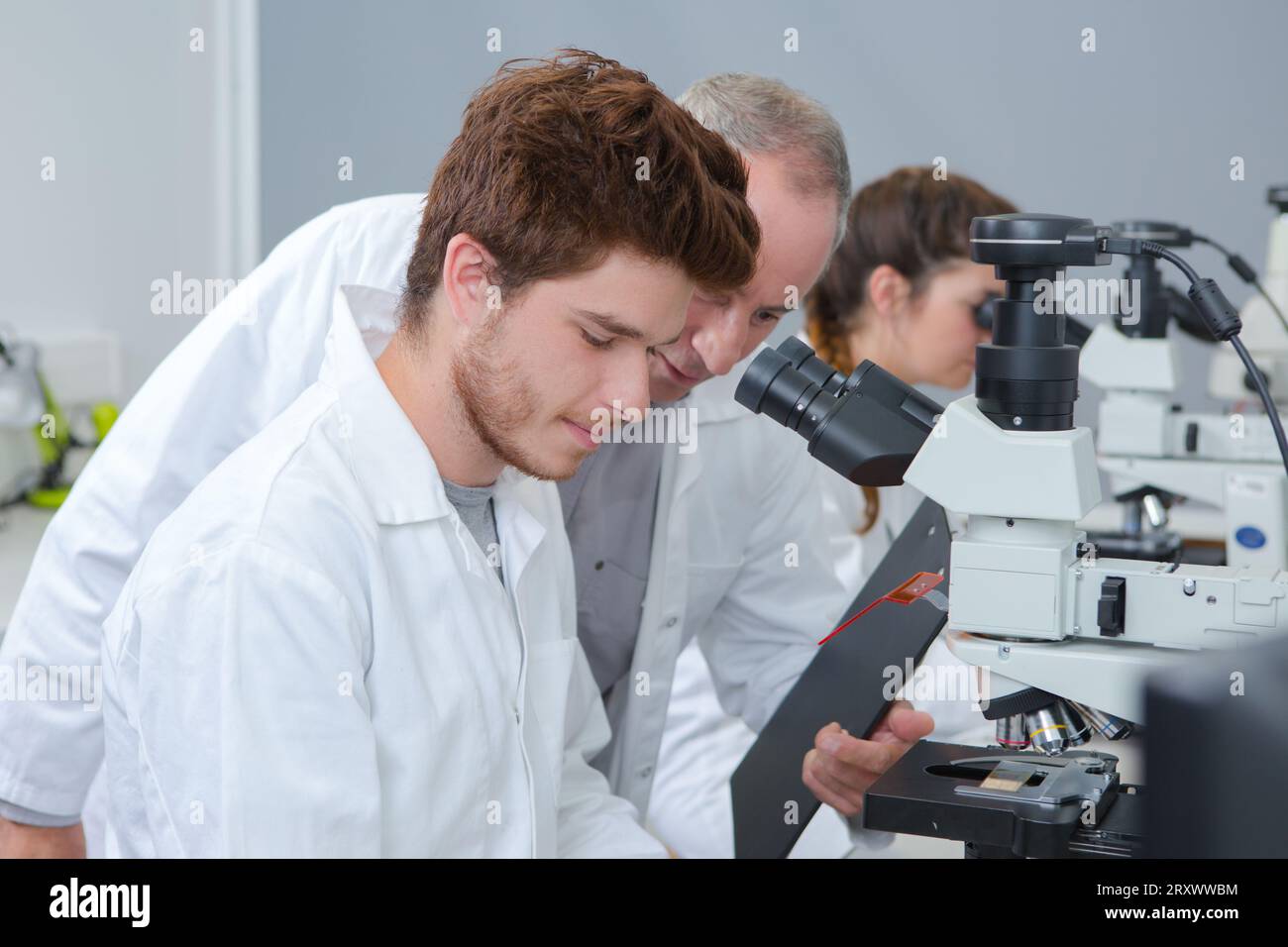 Boy microscope white coat hi-res stock photography and images - Alamy