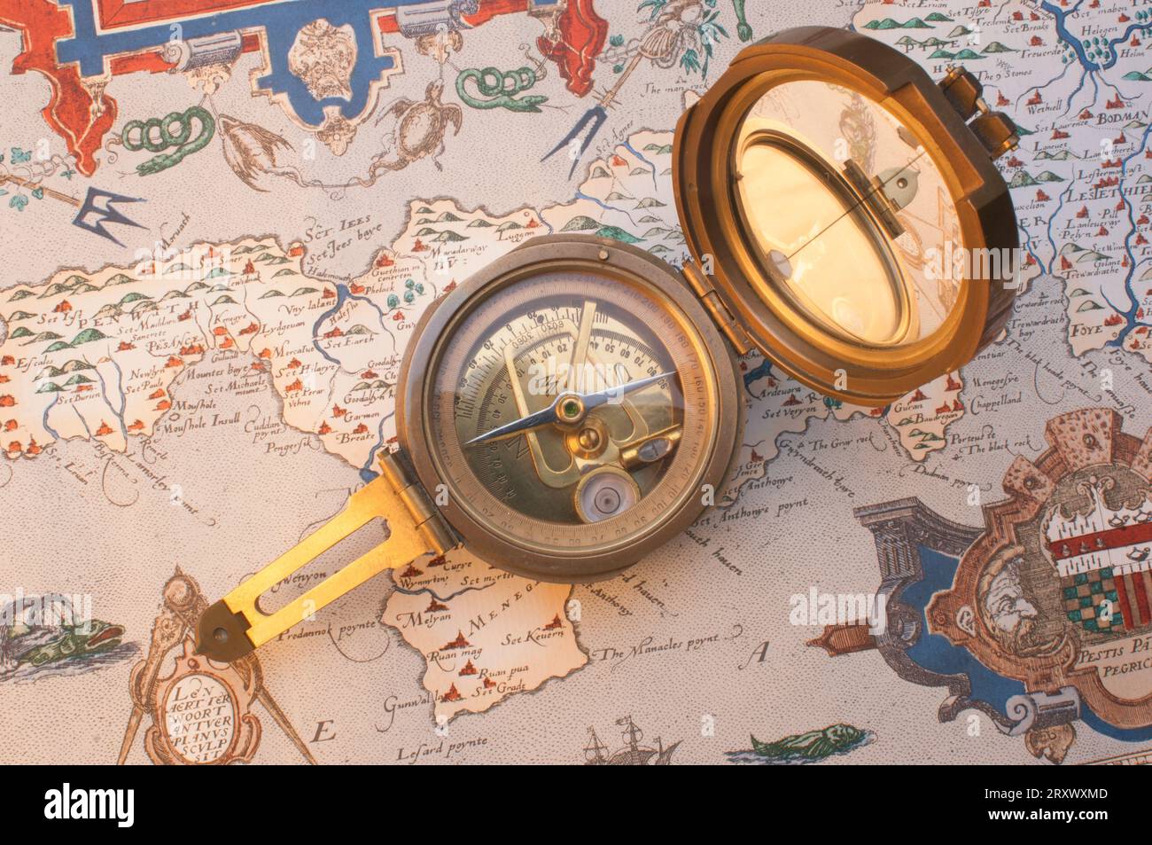 An old brass compass lying on an ancient map of Cornwall - John Gollop ...