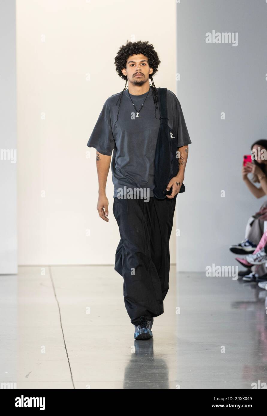 Model walks runway showing design by Jenny Kim and Haeun Lee for Kimmy ...