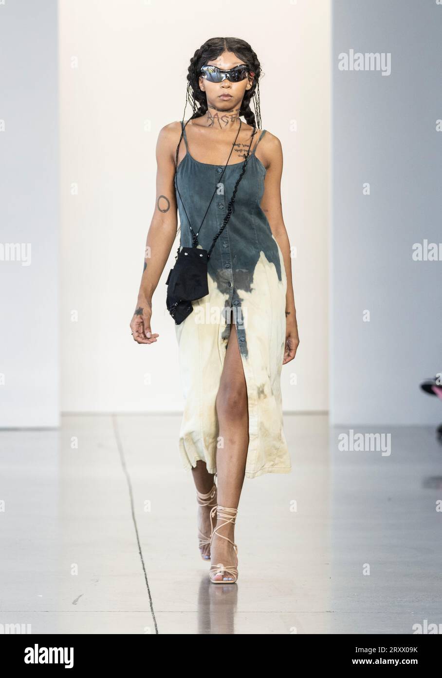 Model walks runway showing design by Jenny Kim and Haeun Lee for Kimmy ...