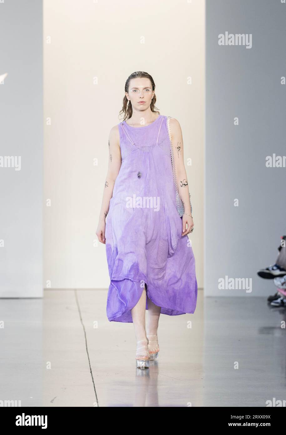 Model walks runway showing design by Jenny Kim and Haeun Lee for Kimmy ...