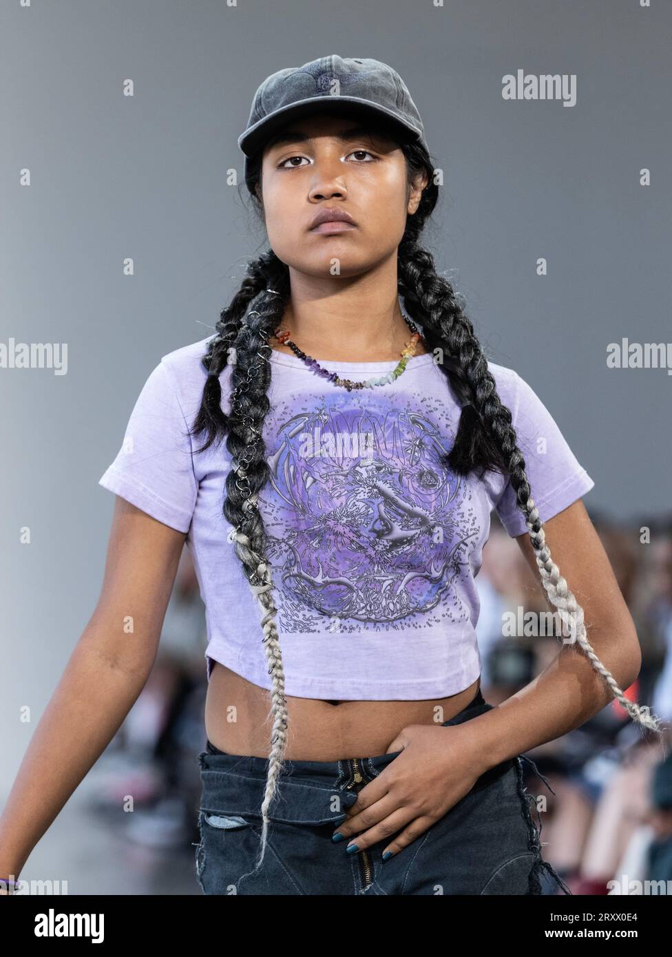 Model walks runway showing design by Jenny Kim and Haeun Lee for Kimmy ...