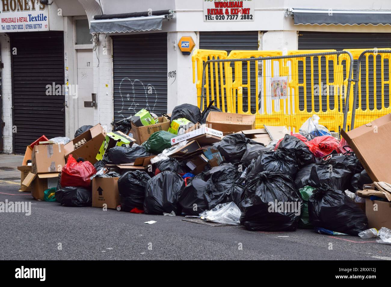 London, UK. 27th September 2023. Huge piles of garbage line the streets near Whitechapel as ...