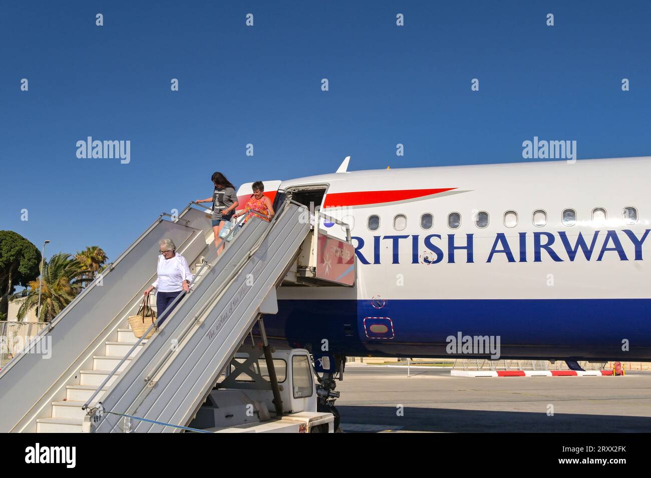 Luqa, Malta, UK - 1 August 2023: Passengers getting off an Airbus A321 ...