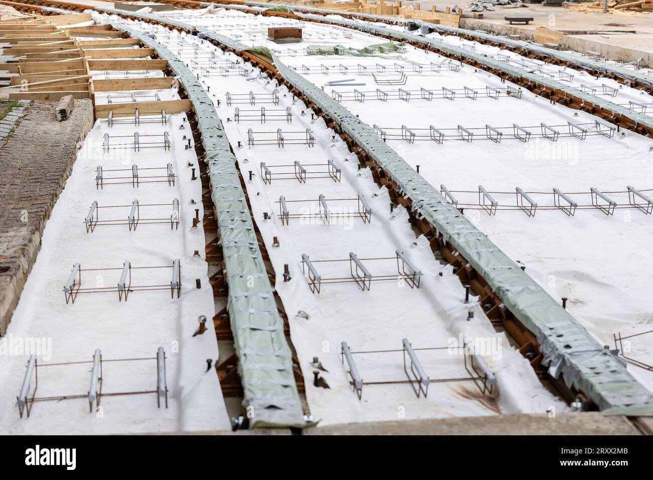 New tram rails laying on european city street. Installation modern ...
