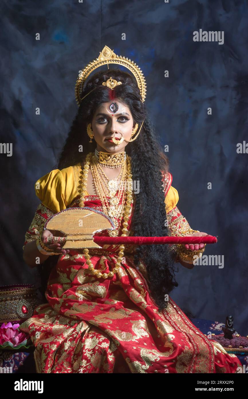 Portrait of beautiful Indian girl of Durga Idol Agomoni Concept Indoor ...
