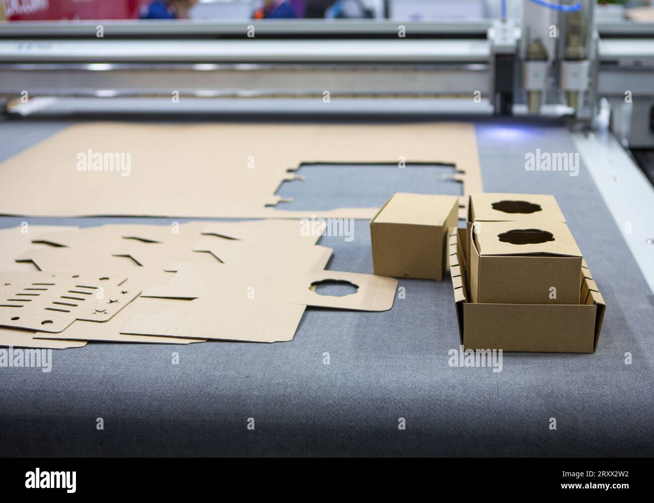 Digital die cut machine cutting corrugated cardboard products ...