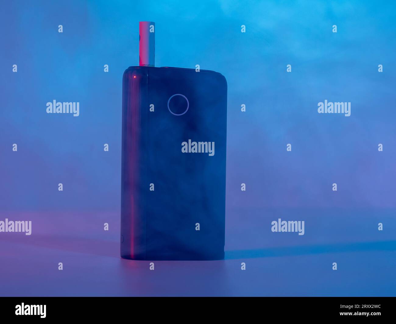 The vaporizer of an electronic cigarette in the smoke is illuminated ...