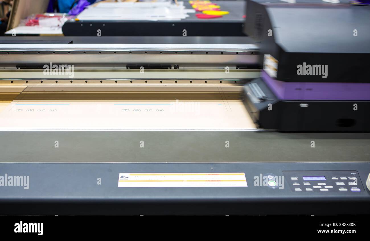 Flatbed UV LED Inkjet Printer. Cardboard packaging printing Stock Photo ...