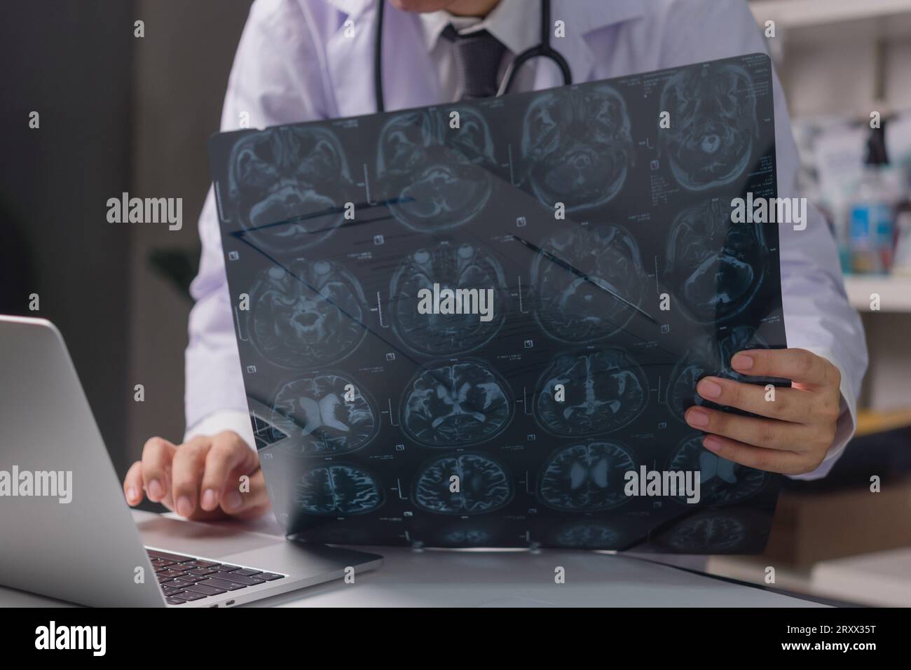 man doctor watching patient x-ray film, MRI and CT scan. Health care ...