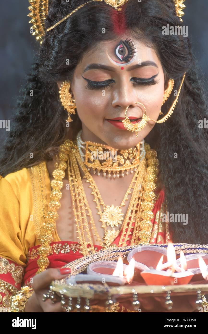 Portrait of beautiful Indian girl of Durga Idol Agomoni Concept Indoor ...