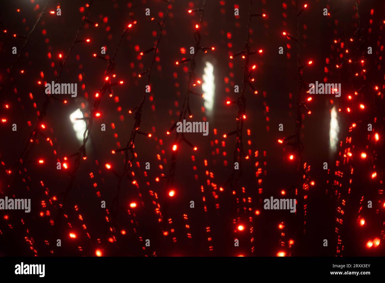 Red lights in dark. Lights on glass. Indoor games. Interior details ...