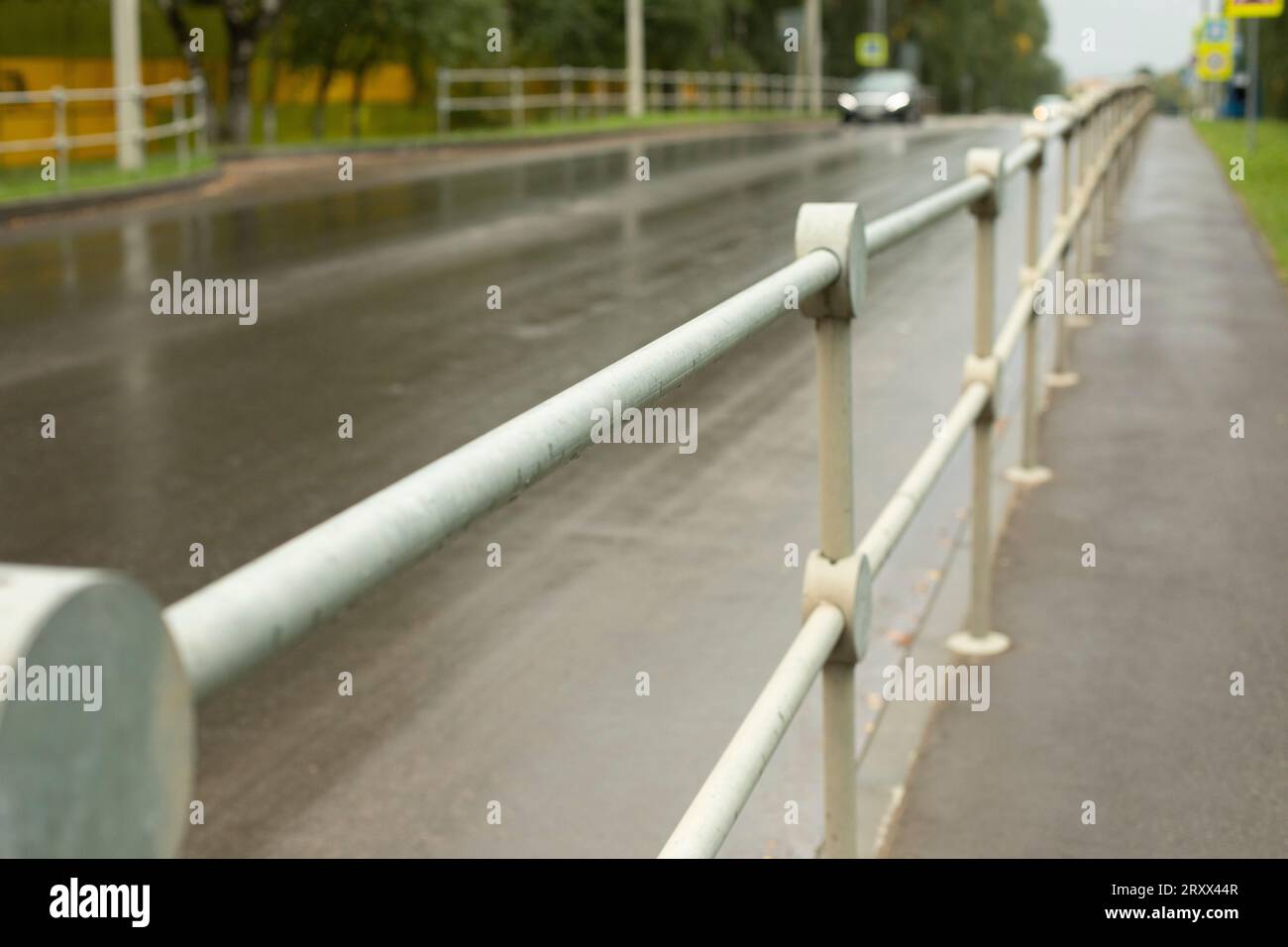 Pedestrian sidewalk along fence hi-res stock photography and images - Alamy