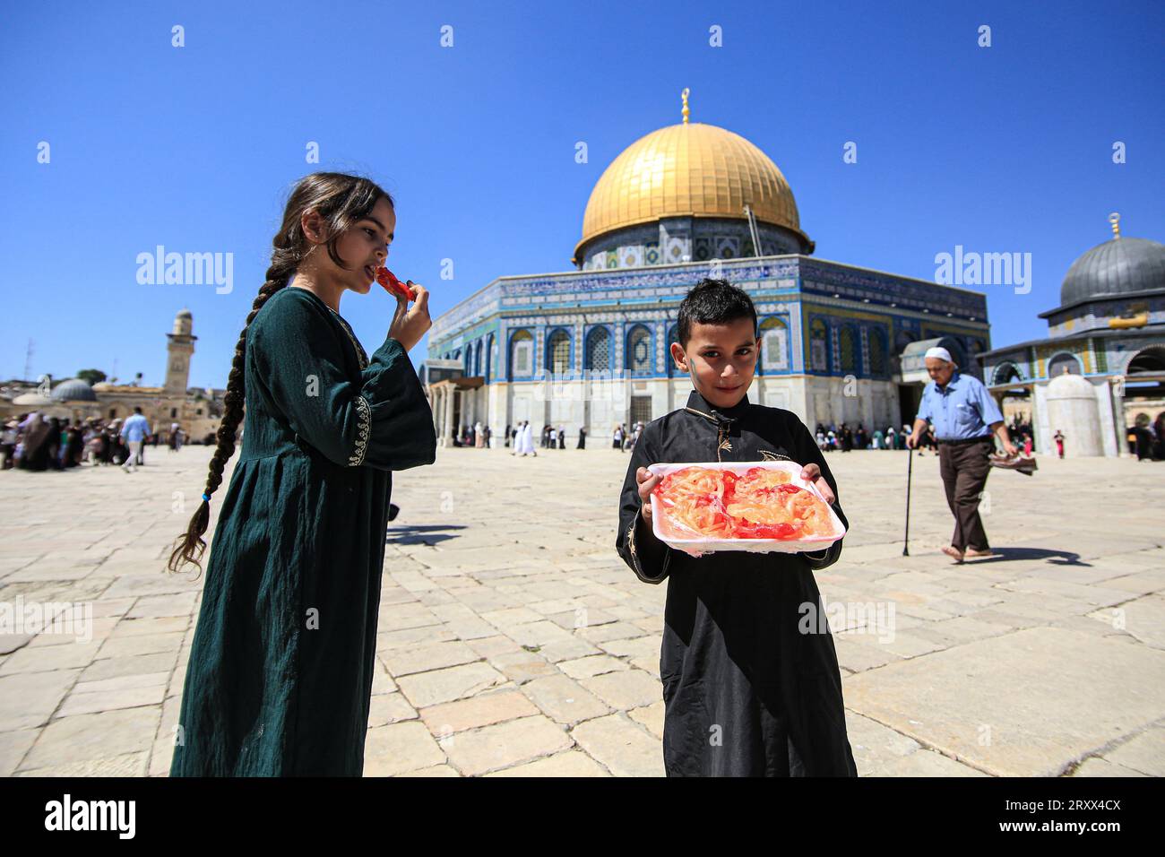 A Palestinian kid shows his gift during the gather to commemorate the ...