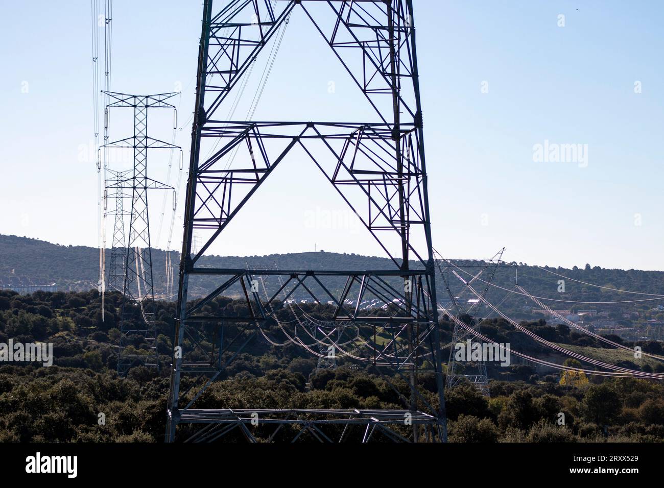 Electric cable laying towers in the forest of the Sierra de Madrid in ...