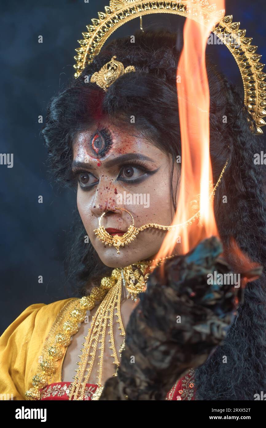 Portrait of beautiful Indian girl of Durga Idol Agomoni Concept Indoor ...