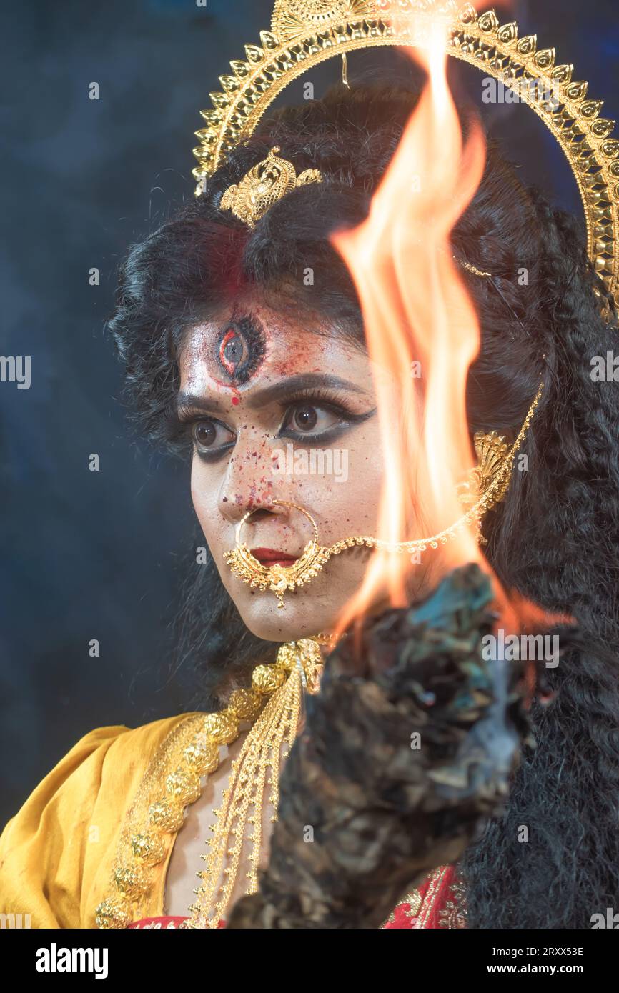 Portrait of beautiful Indian girl of Durga Idol Agomoni Concept Indoor ...
