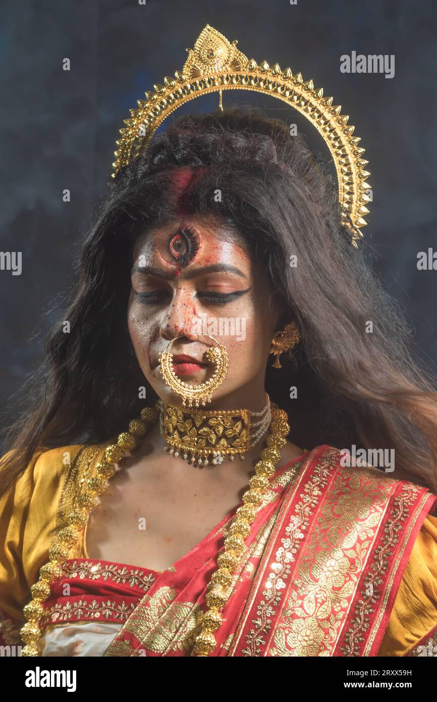 Portrait of beautiful Indian girl of Durga Idol Agomoni Concept Indoor ...