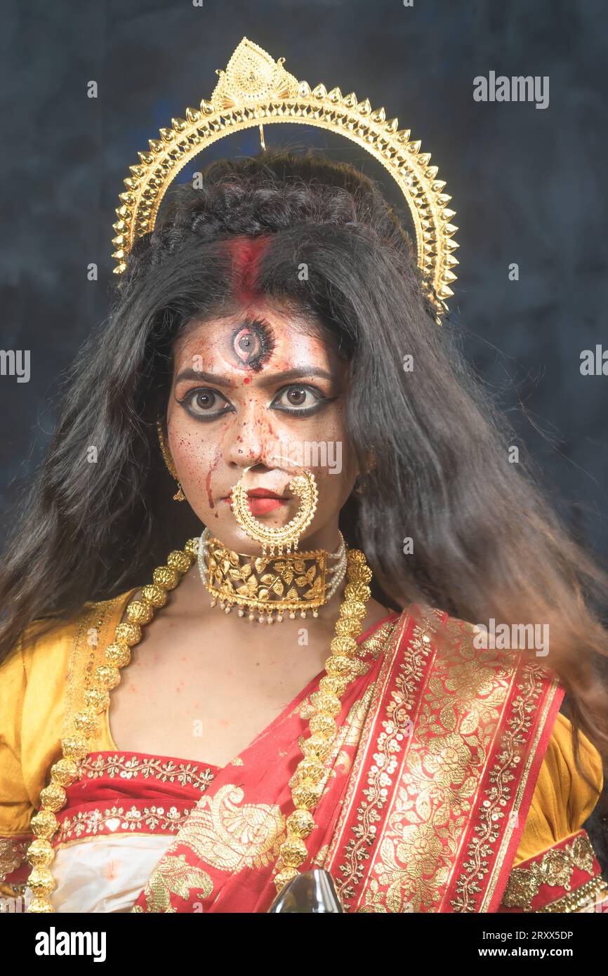 Portrait of beautiful Indian girl of Durga Idol Agomoni Concept Indoor ...
