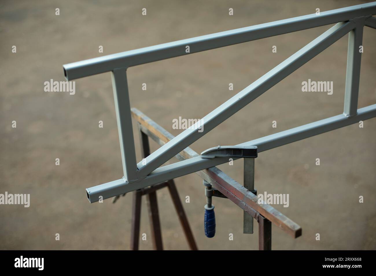 Steel part on street. Metal profile with holder. Steel construction ...