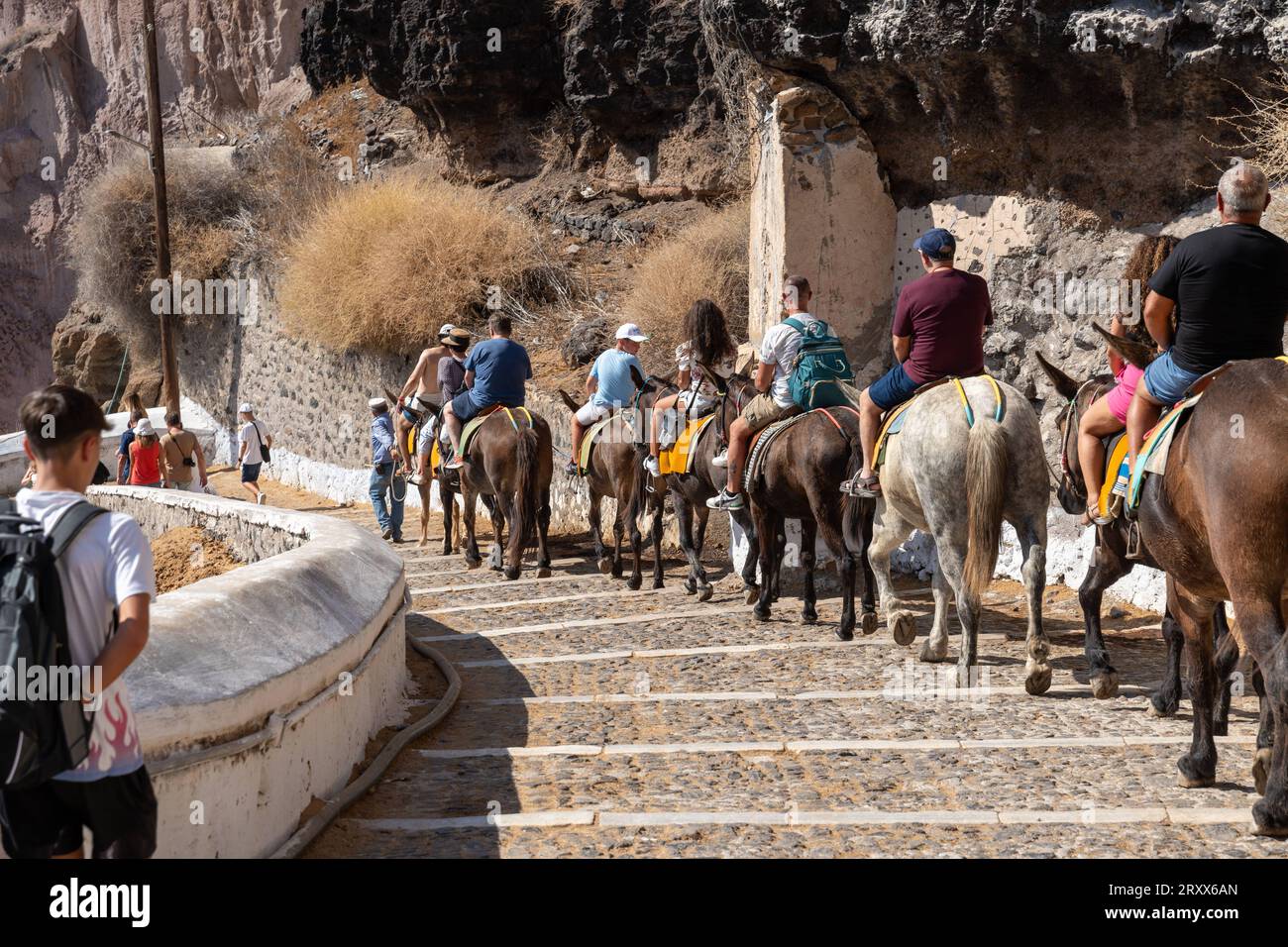 Santorini Greece - 20 September 2023: Tourists riding traditional ...