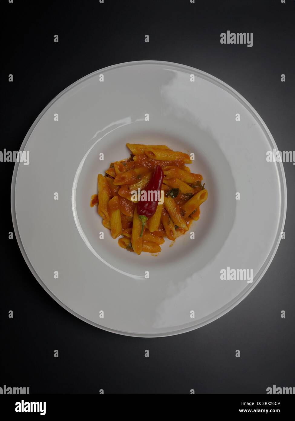 Classic Italian Pasta Penne Arrabiata With Chili Peppers Basil On Dark Table Penne With Angry