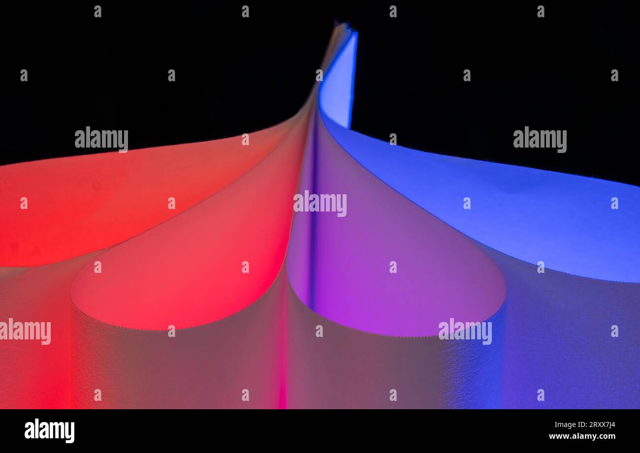 Closeup of red & blue colored curving shapes made for ordinary white ...