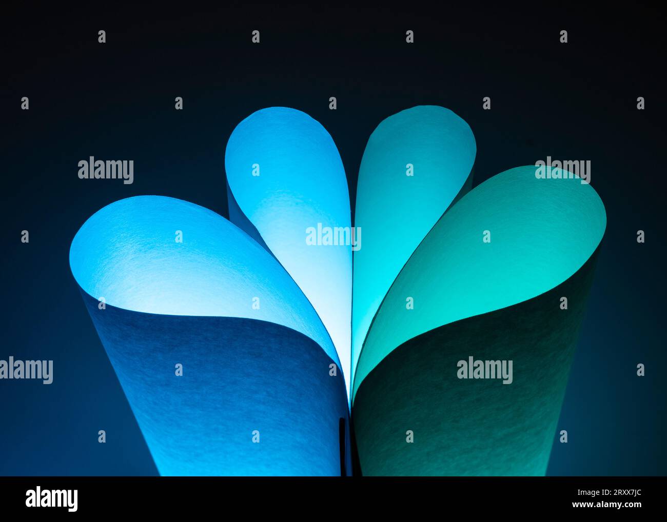 Closeup of green & blue colored curving shapes made for ordinary white ...