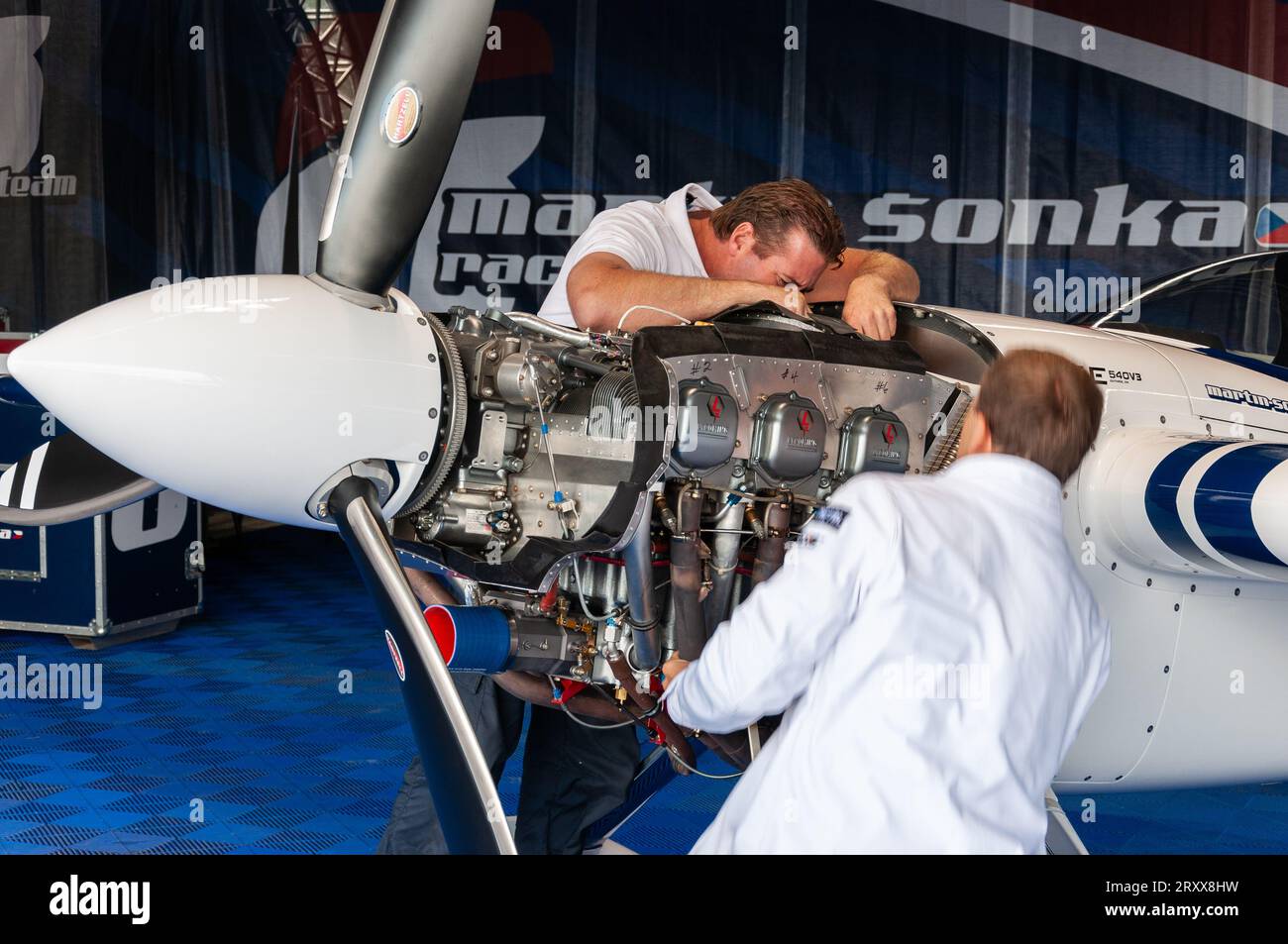 Engineers working on the Lycoming engine of pilot Martin Sonka's Zivco ...