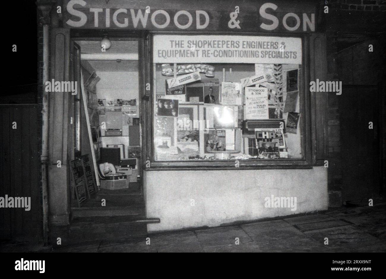 1960s, historical, exterior of the Stigwood & Son store, window banner ...