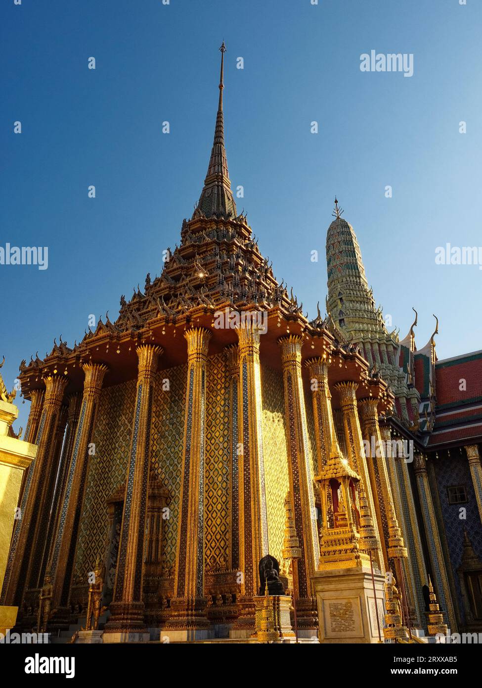 An opulent Thai shrine, adorned with aureate spires and intricate ...