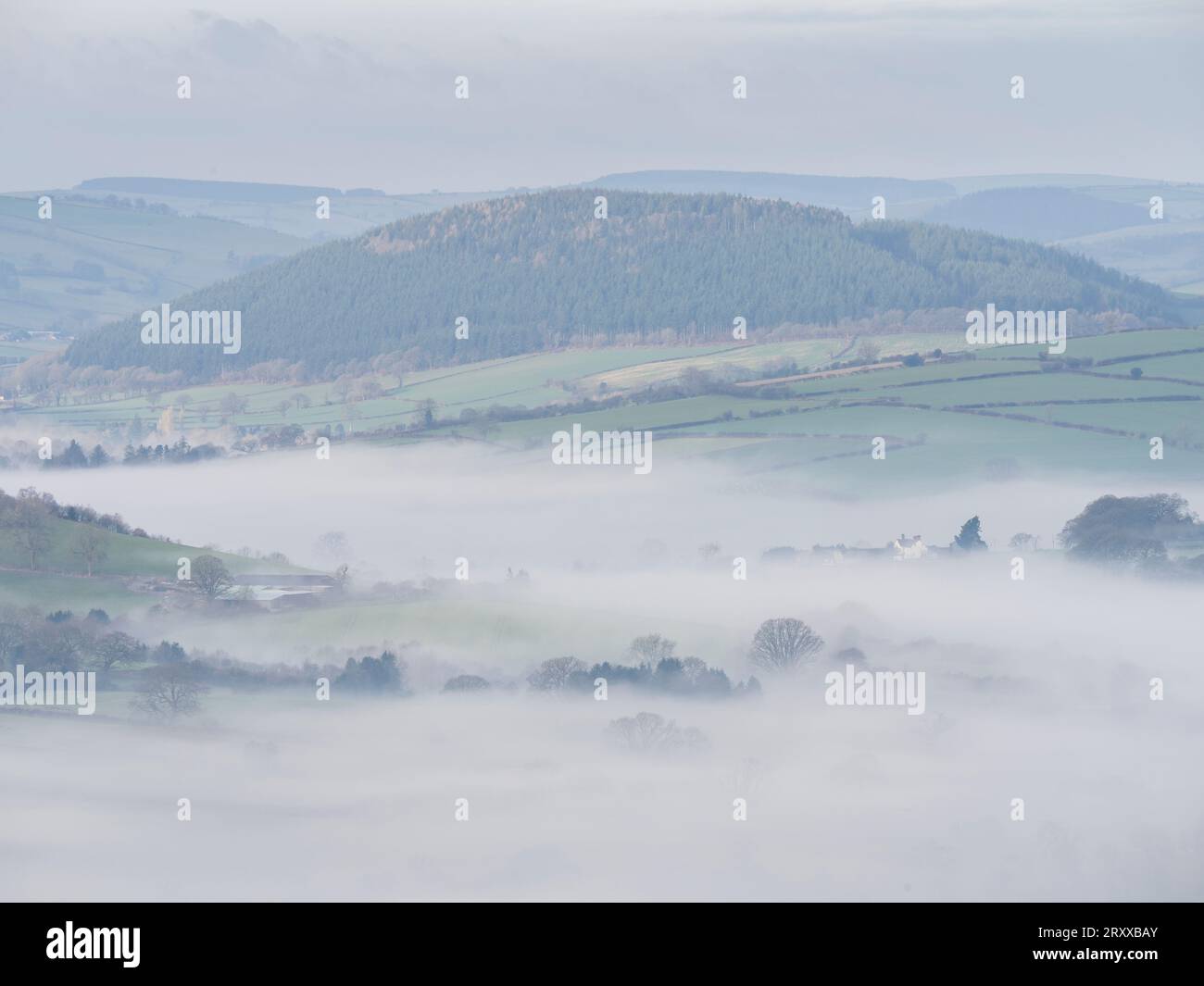Morning mist hanging over the Clun Valley in South Shropshire, England ...