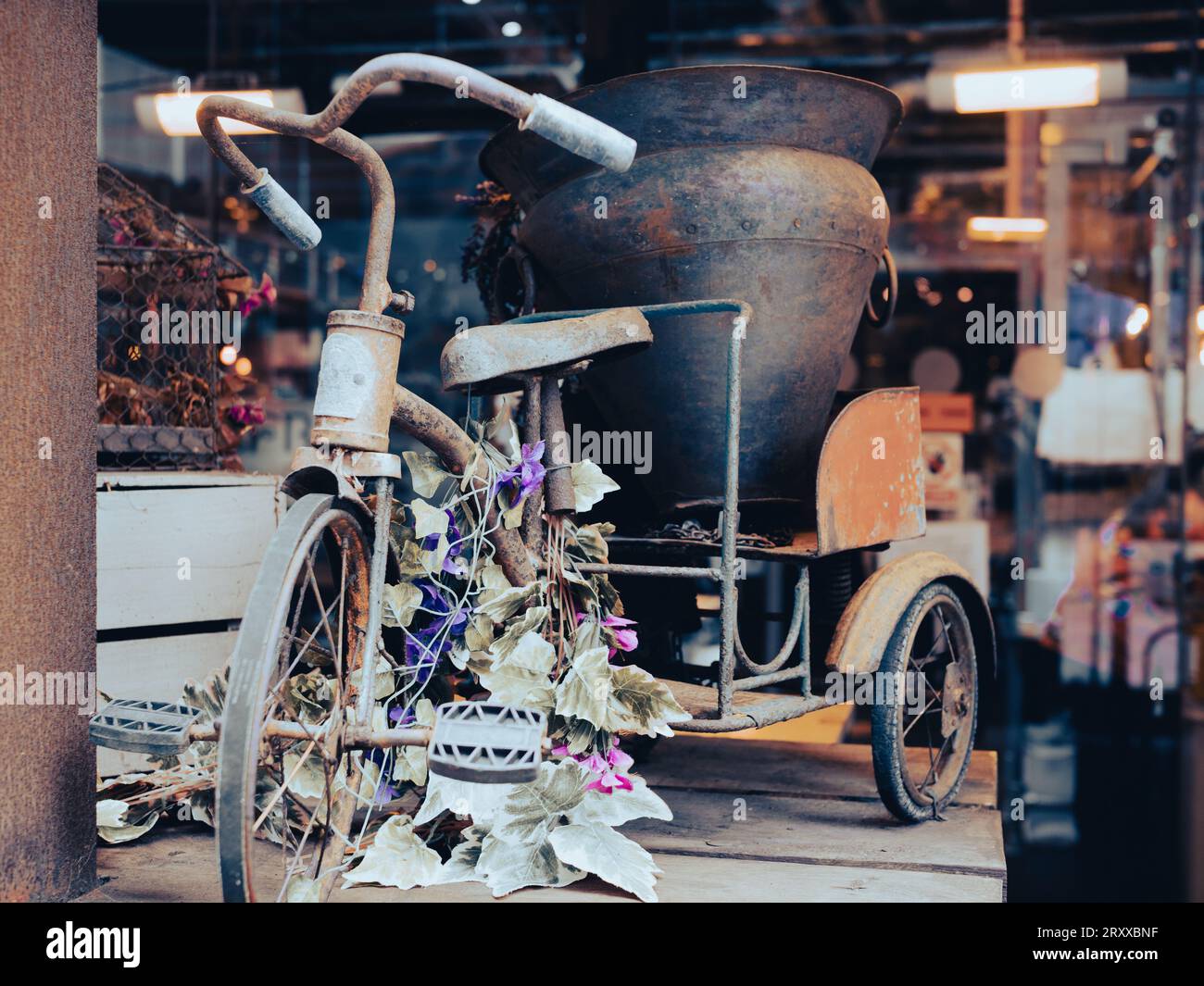rusty old child's tricycle bike with a small trailer behind Stock Photo ...