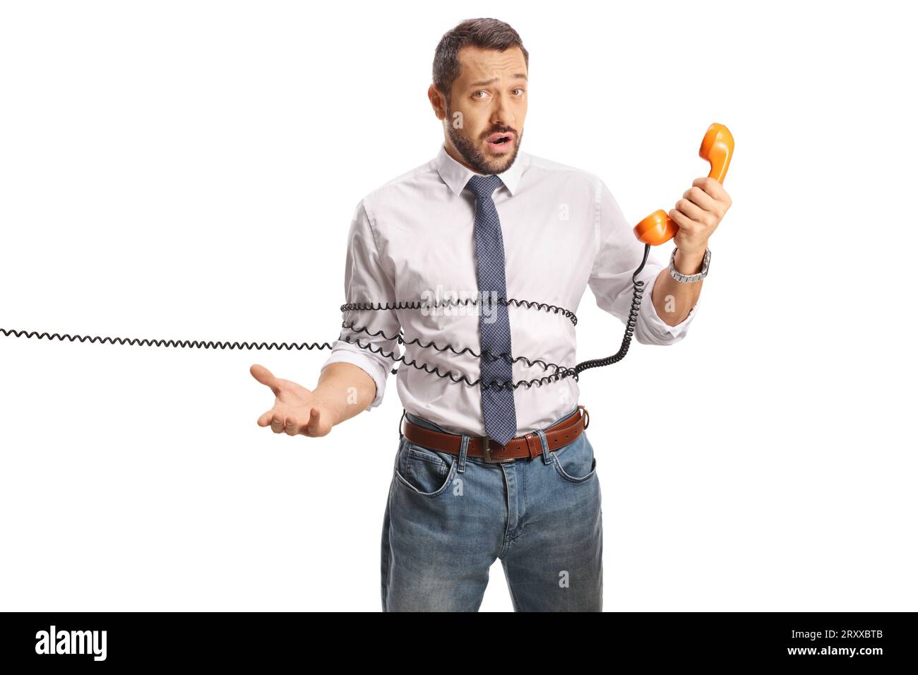 Irritated man tangled in a cable from a vintage rotary phone isolated ...
