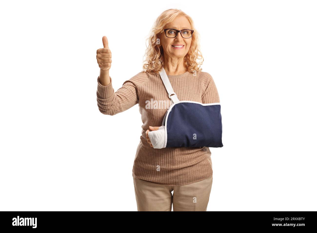 Woman with an arm injury wearing a sling and gesturing thumbs up ...