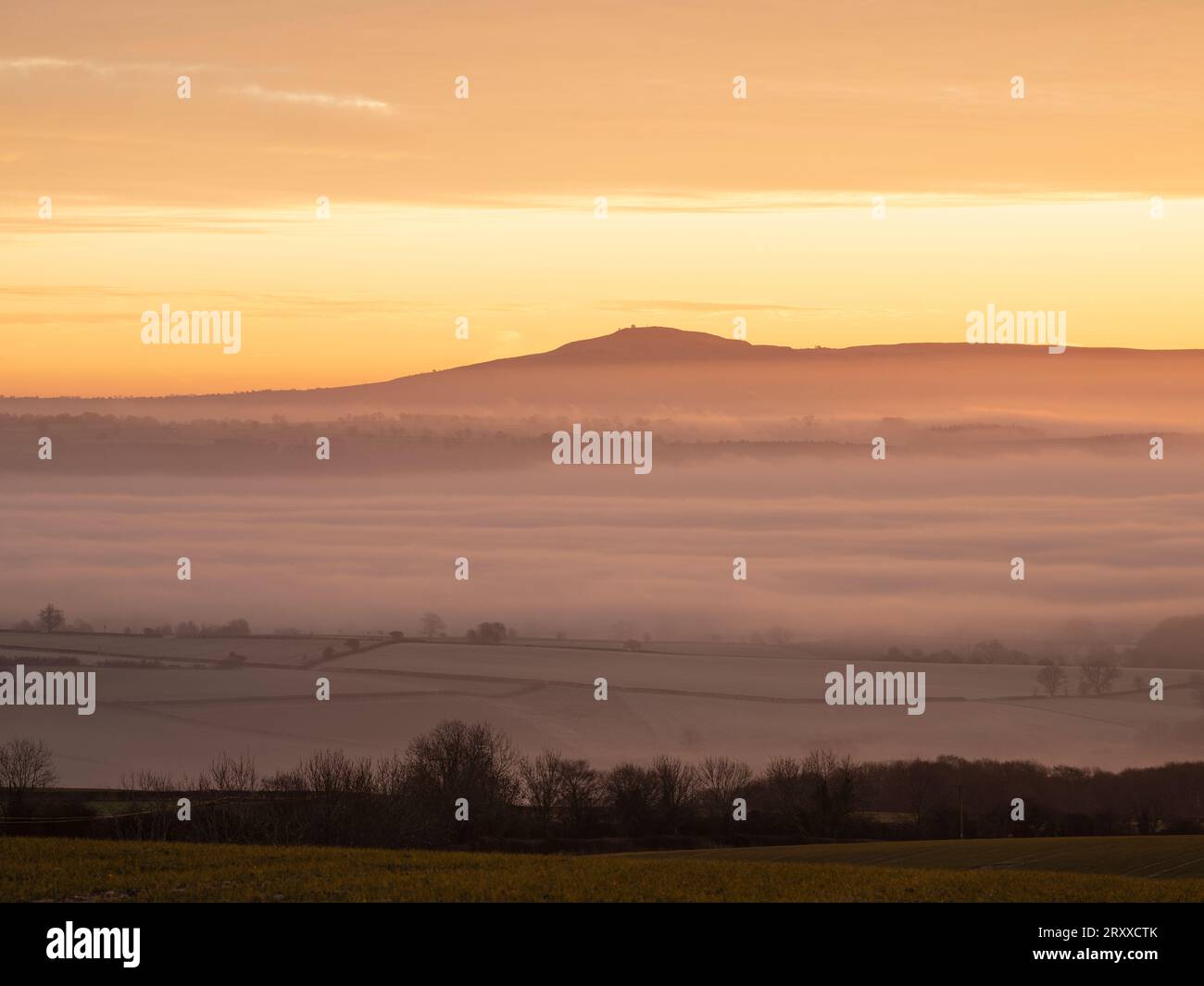 A dramatic Sunrise over Clee Hill and Ludlow viewed from Goat Hill near ...