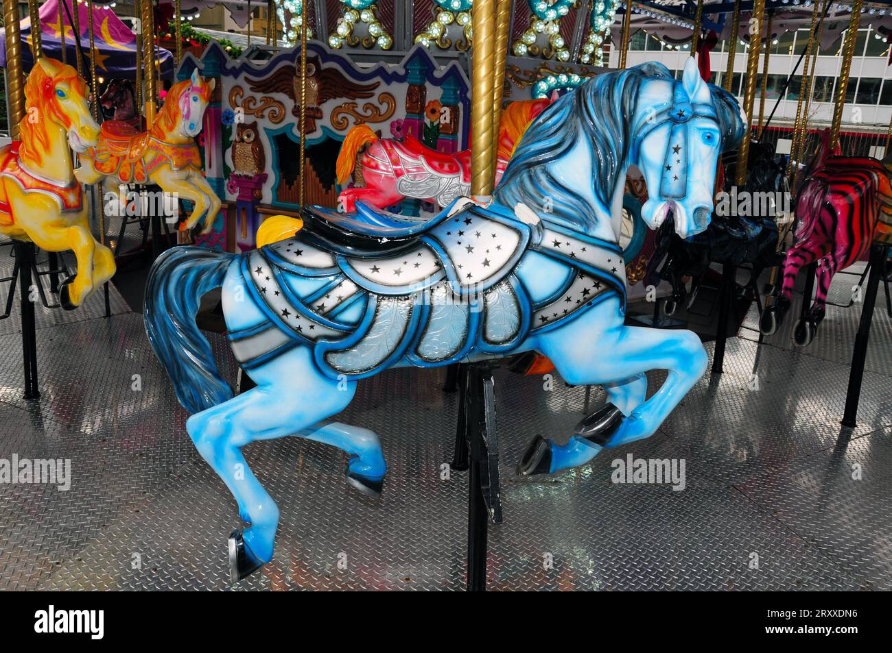 Blue carousel horse on merry-go-round Stock Photo - Alamy