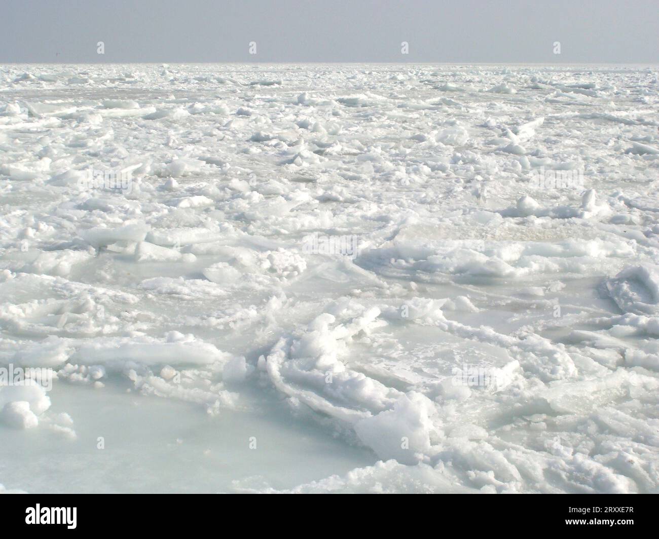 Frozen sea with ice floes and snowdrifts. Snowy plains of icy expanse ...
