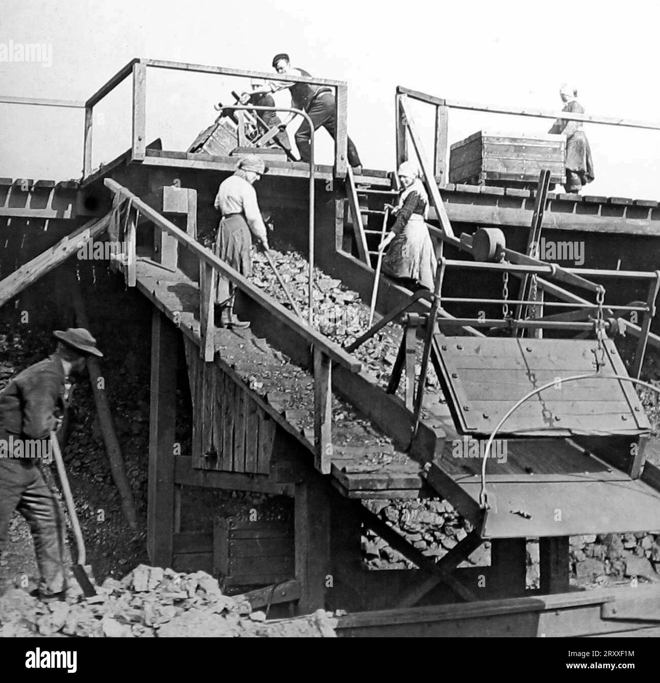 Pit lasses working on a scree at an English coal mine, Victorian period ...