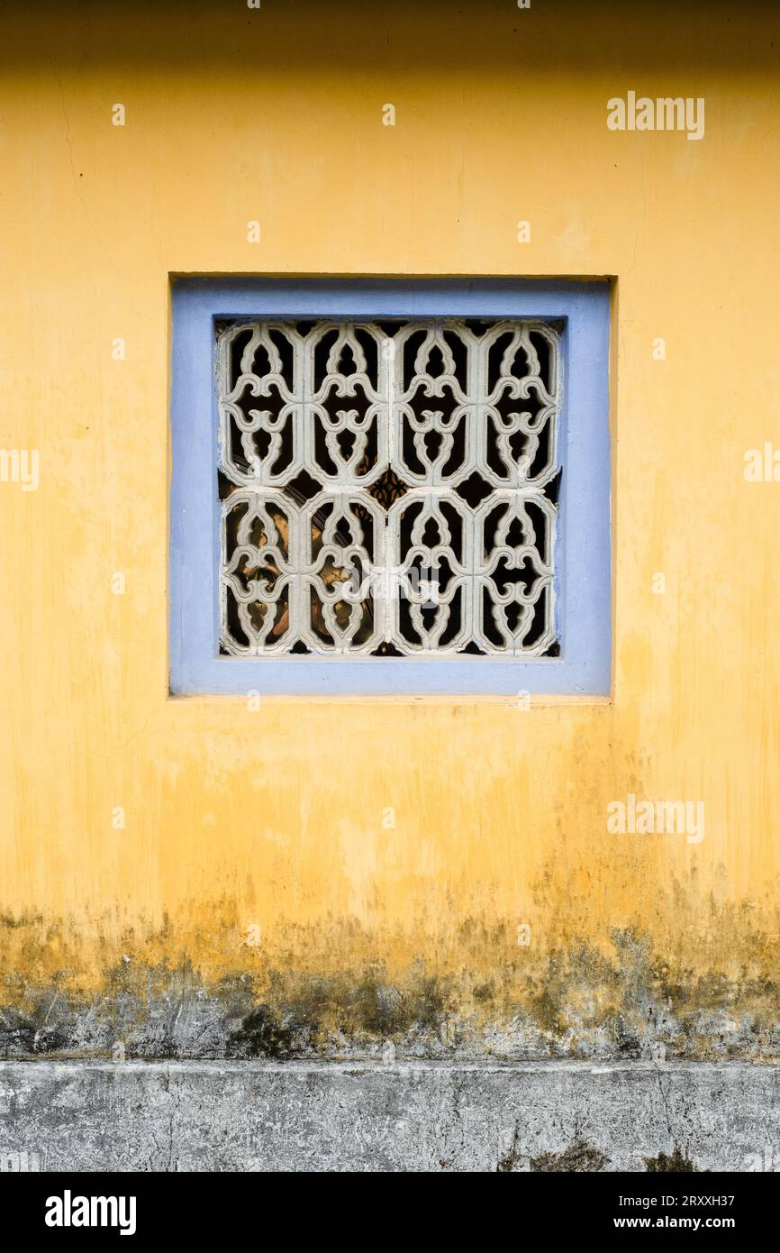 Ornate window on a yellow wall, Imperial City of Huế, Vietnam Stock ...