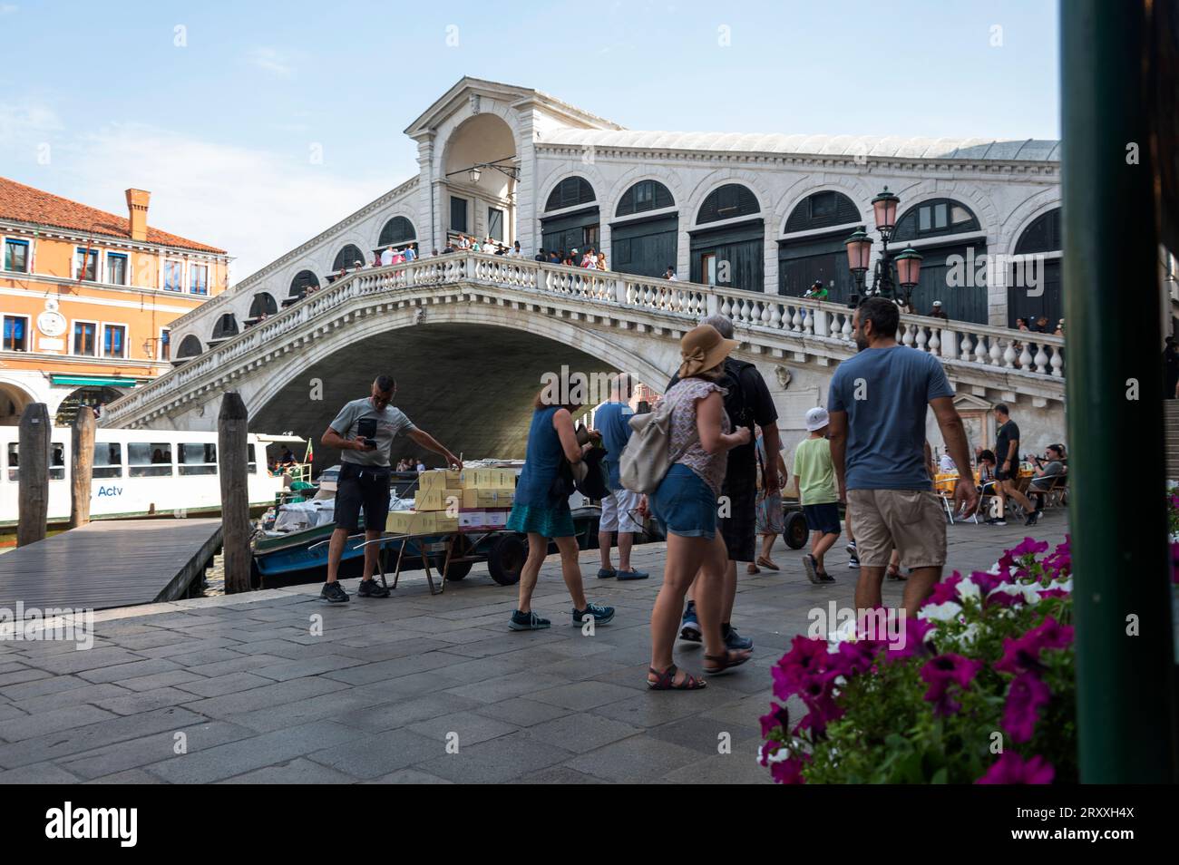 Early risers stroll passed a few moored barges, delivering daily fresh ...