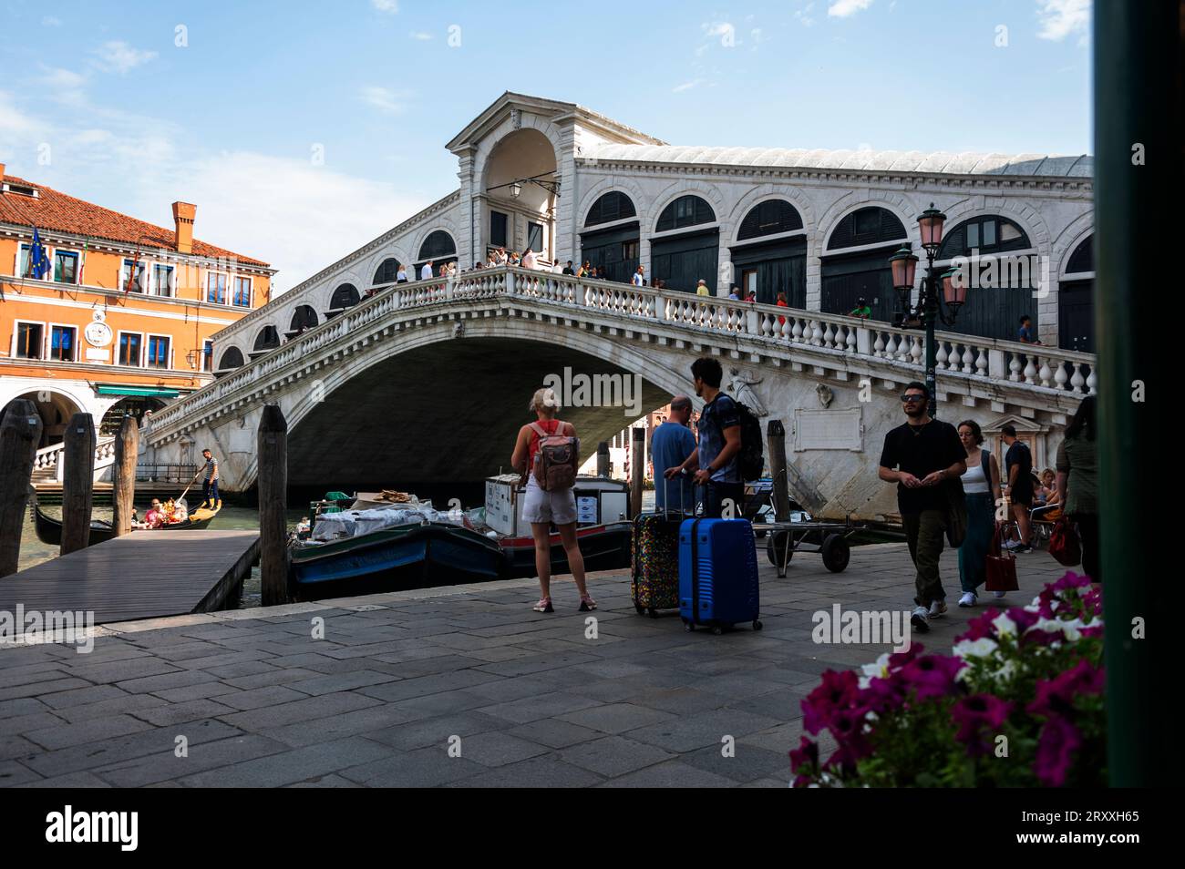 Early risers stroll passed a few moored barges, delivering daily fresh ...